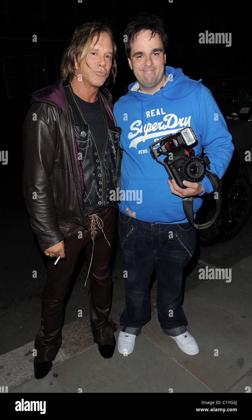 Mickey Rourke arrives back at his hotel with his minder and a male ...