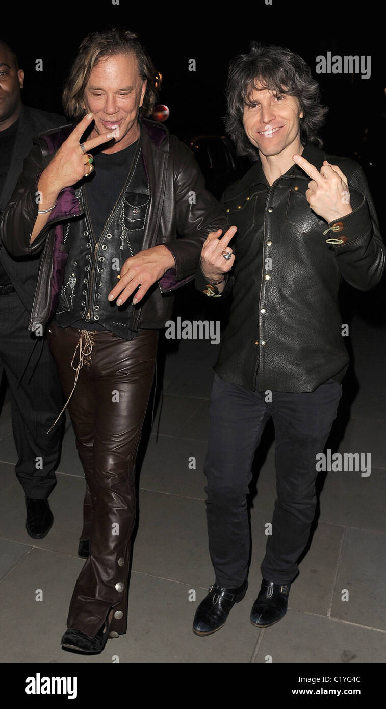 Mickey Rourke arrives back at his hotel with his minder and a male ...