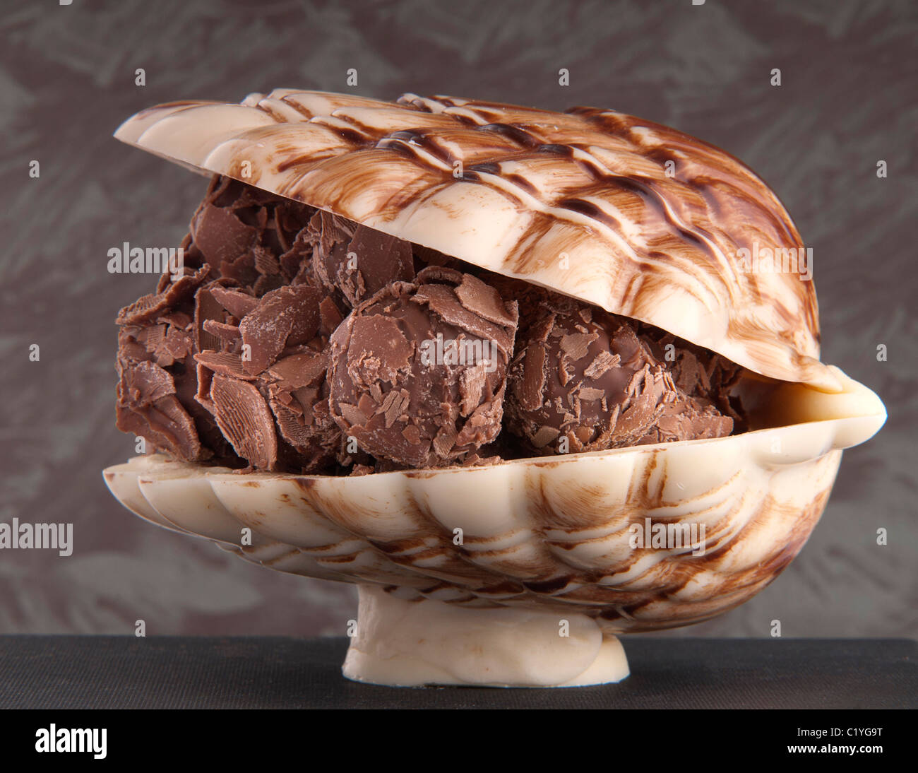 chocolate shell filled with chocolate bonbons Stock Photo - Alamy