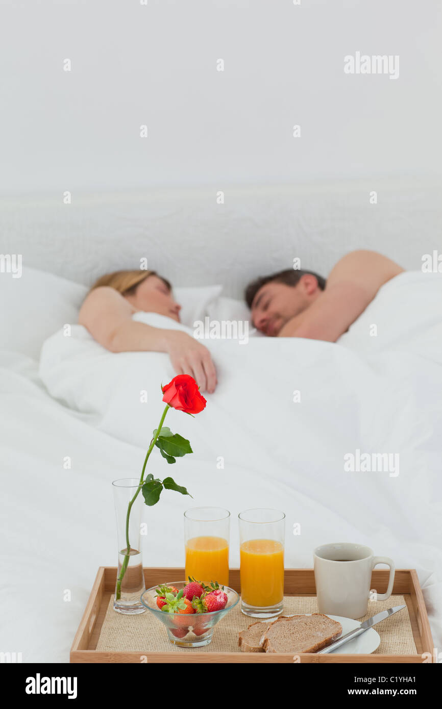 Lovers sleeping before having breakfast Stock Photo - Alamy