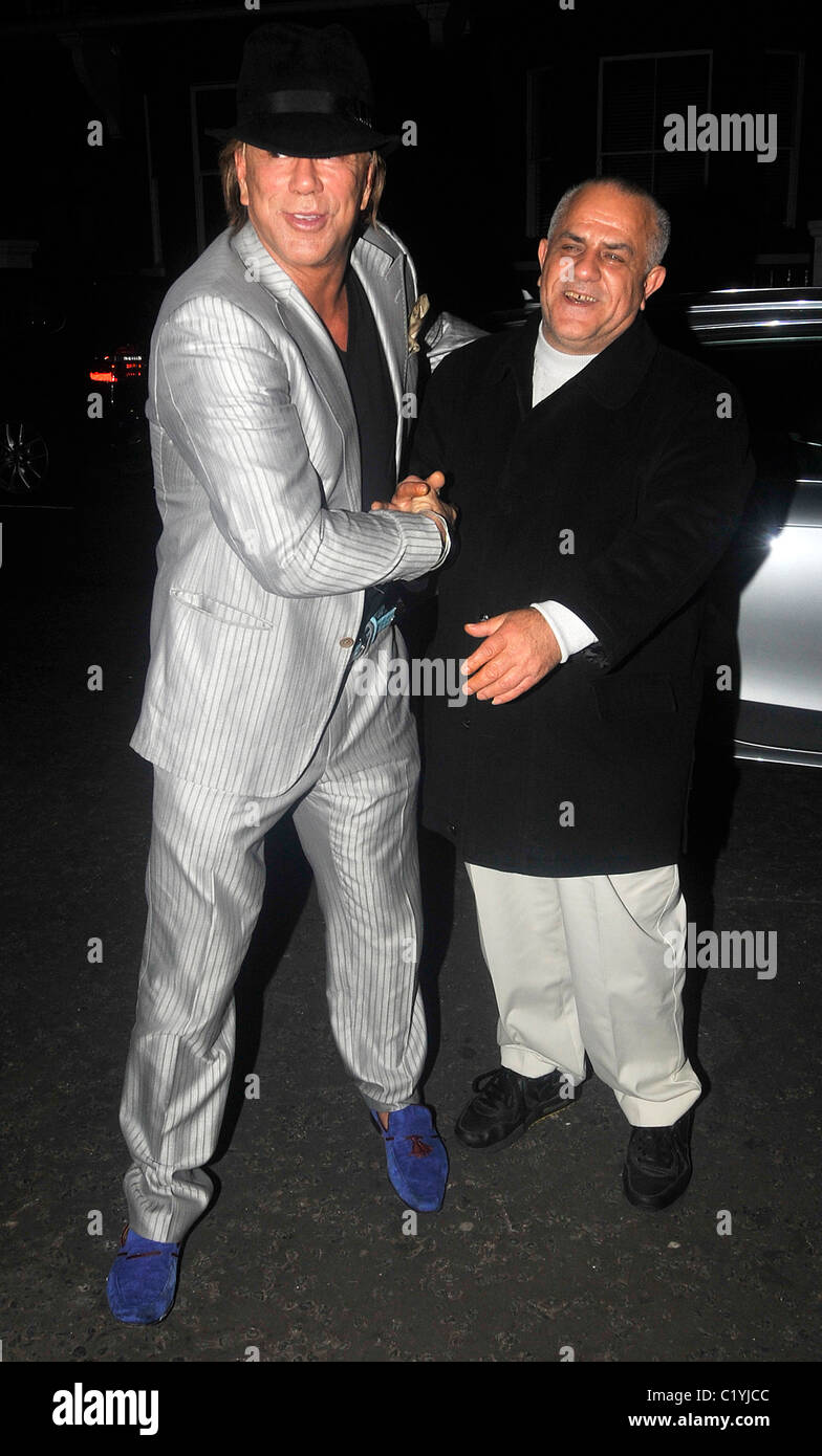 Mickey Rourke leaving Jalouse weaing a silver suit and blue suede shoes ...