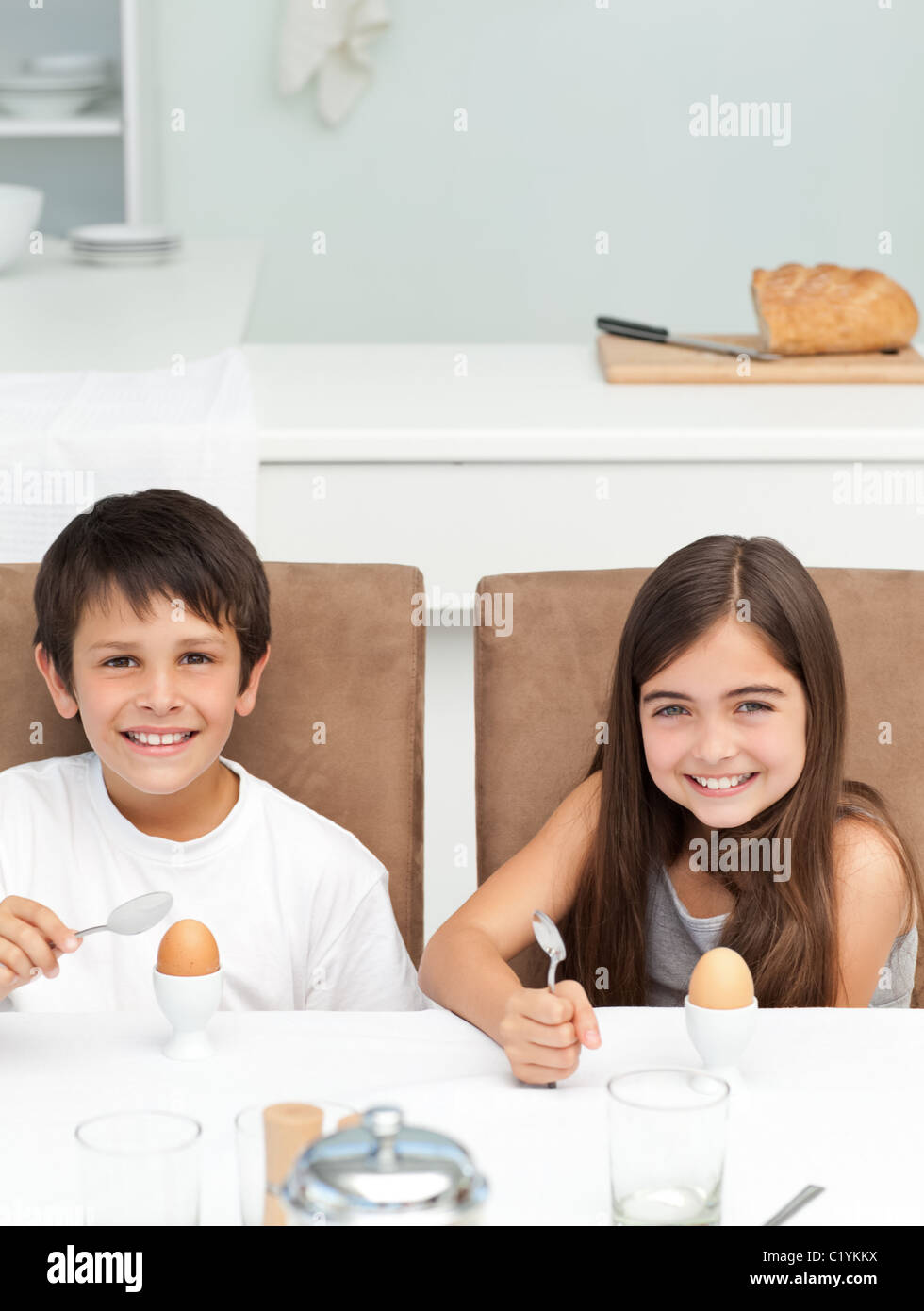Children having breakfast in the kitchen Stock Photo - Alamy