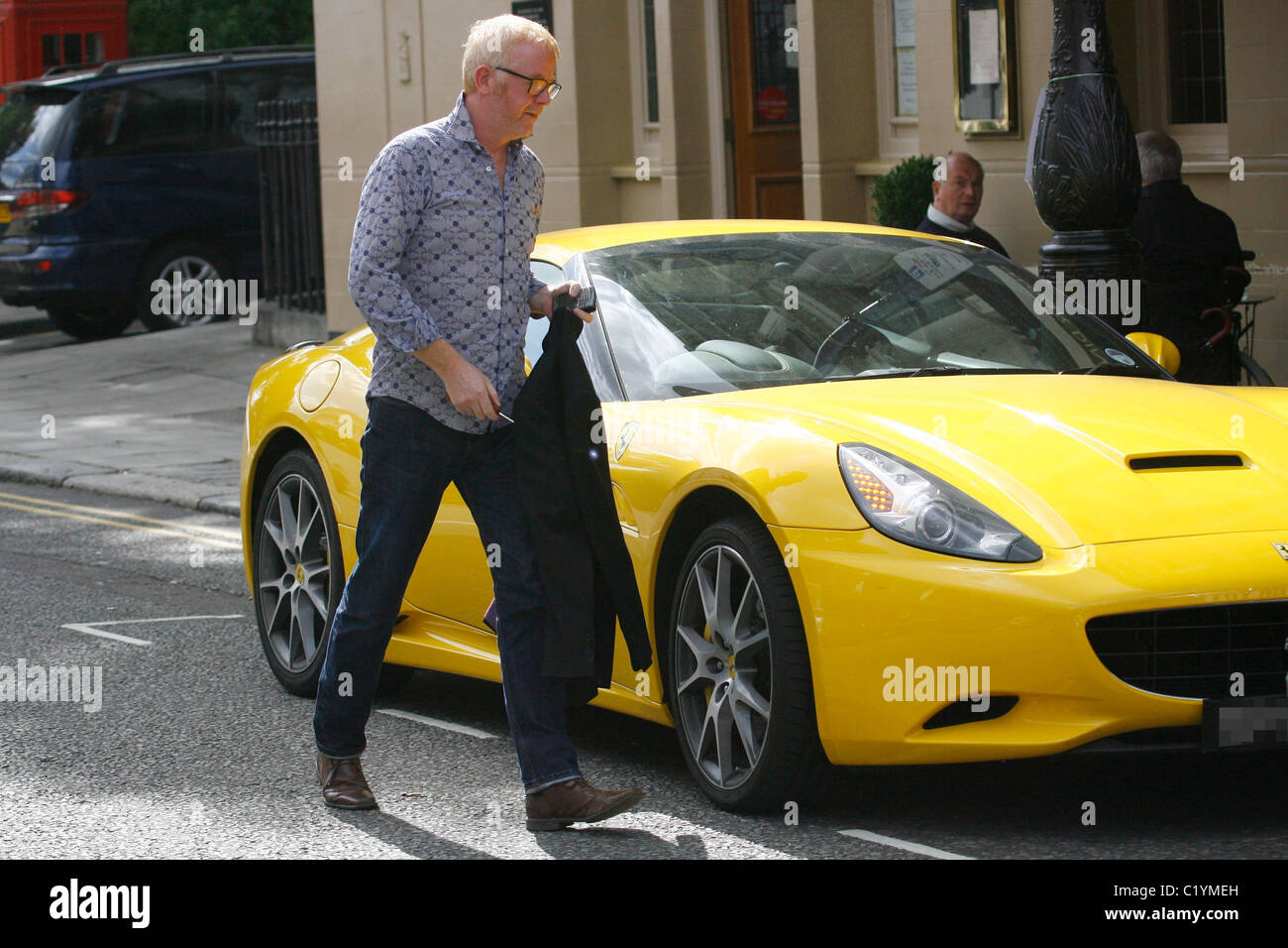 Chris Evans Parks his new yellow Ferrari and heads off to meet friends ...