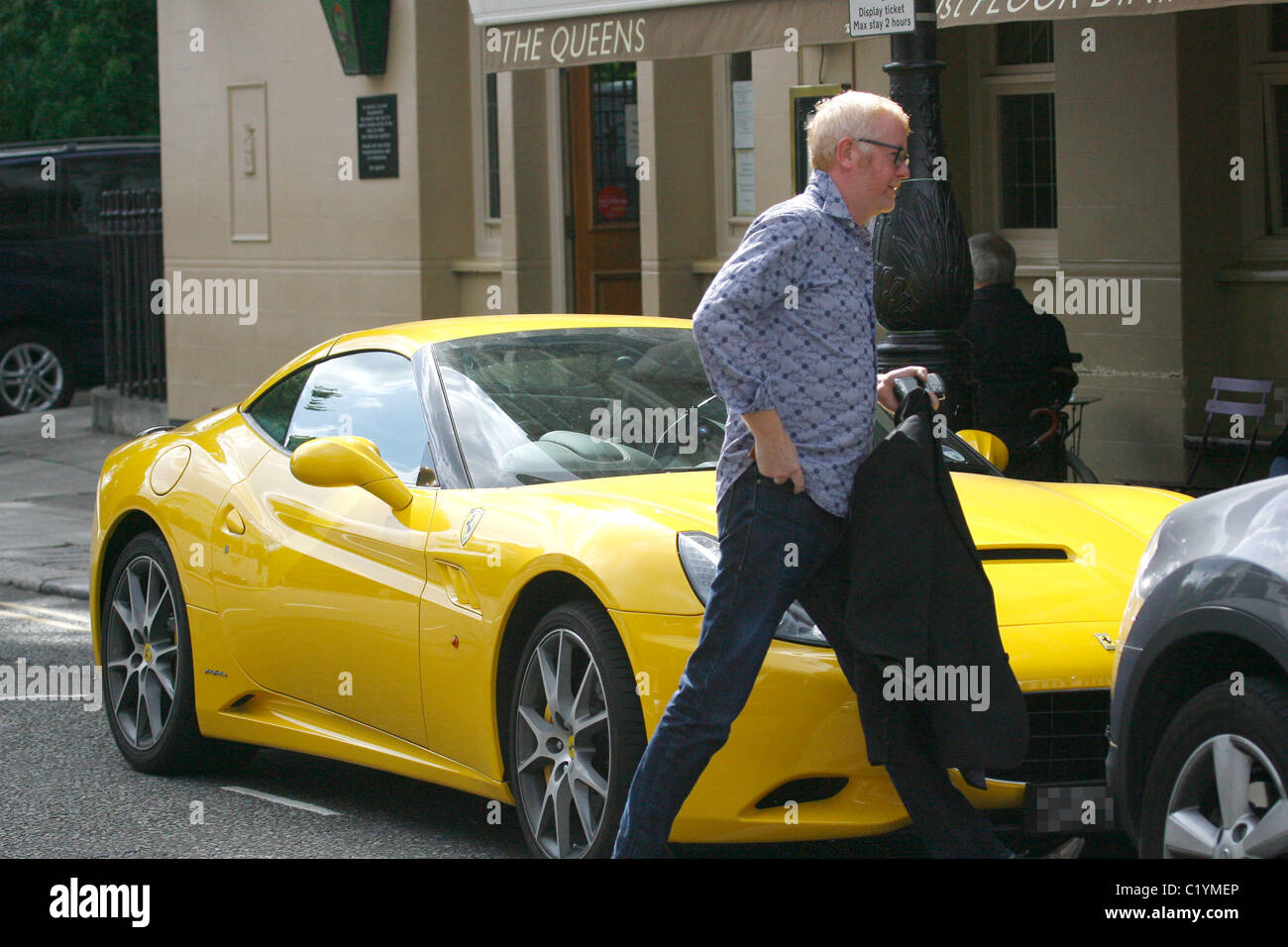 Chris Evans Parks his new yellow Ferrari and heads off to meet friends ...