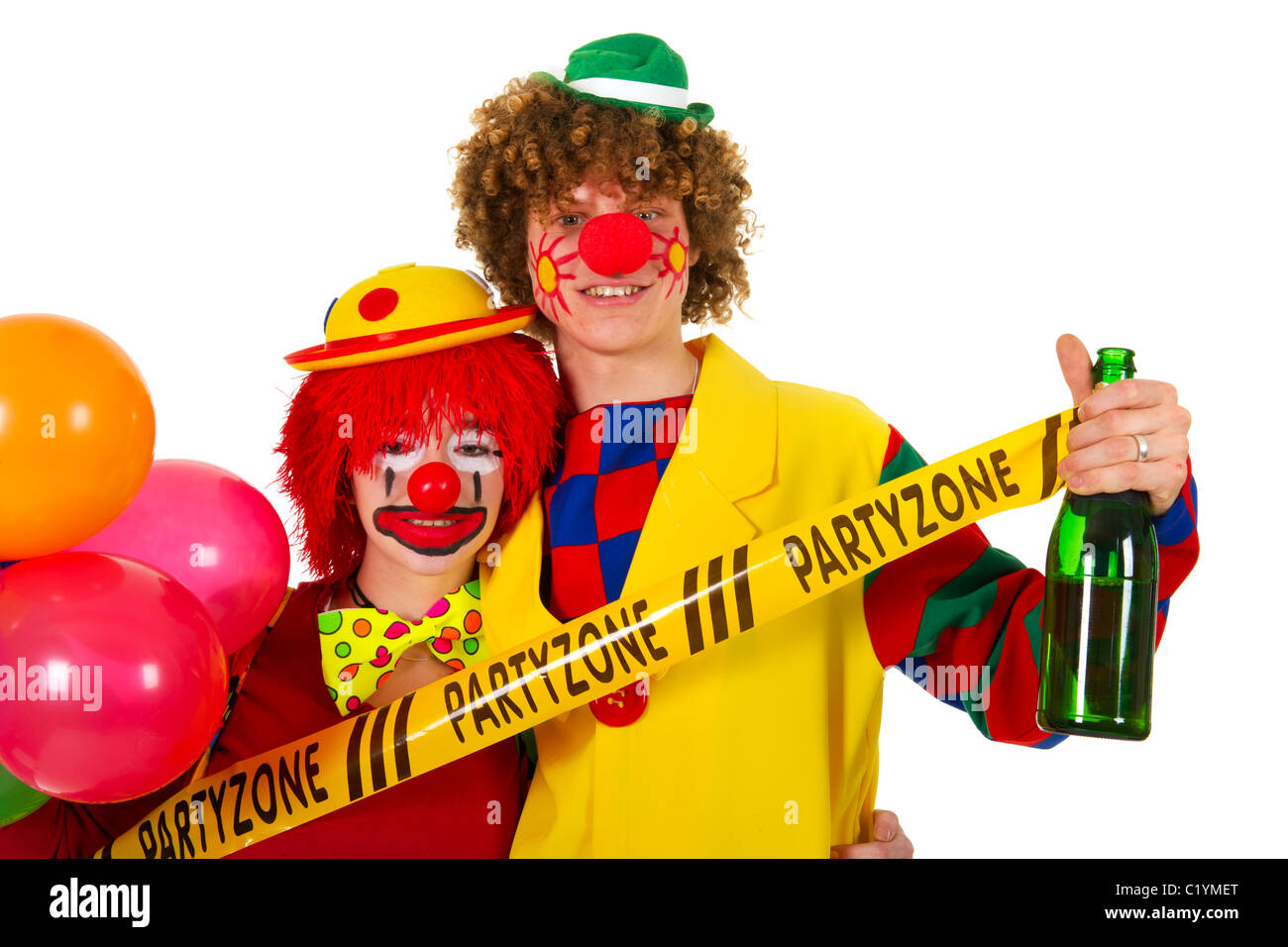 Couple funny clowns with bottle wine in the party zone Stock Photo - Alamy