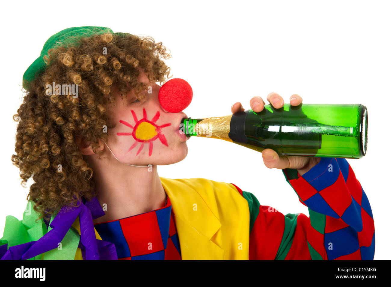 Clown is drinking with a bottle of wine Stock Photo - Alamy