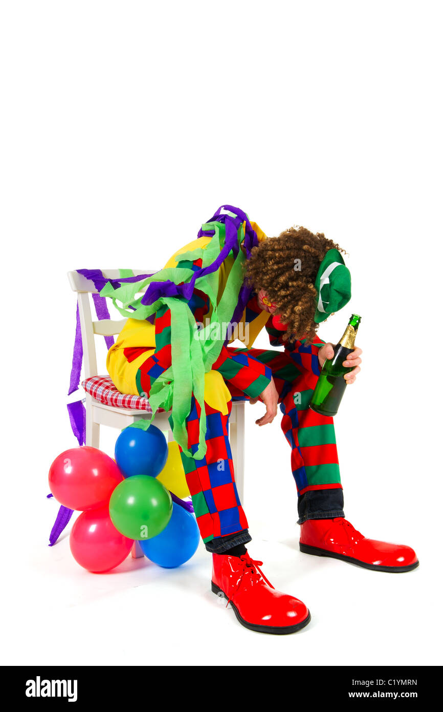 Clown is drinking with a bottle of wine Stock Photo - Alamy