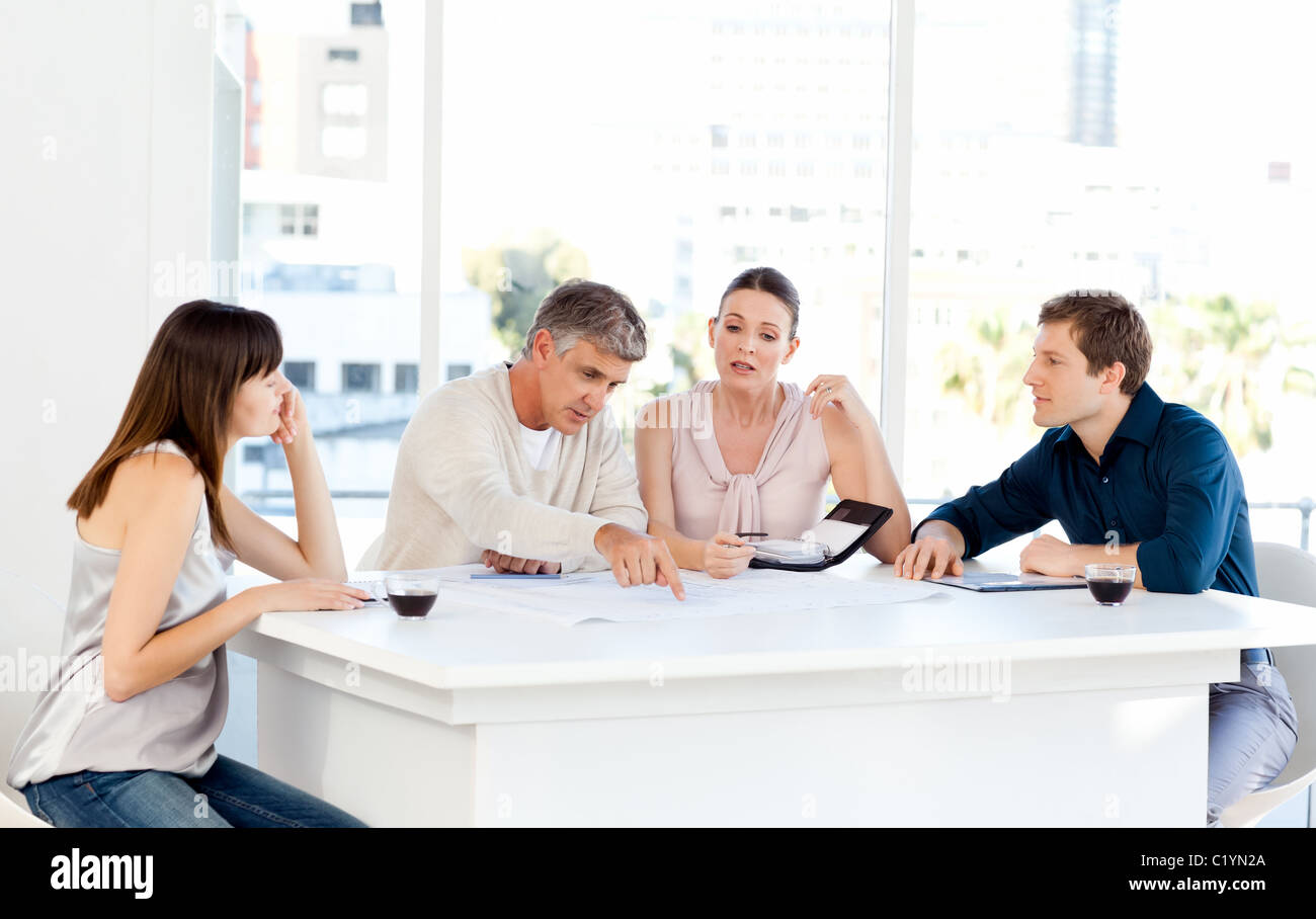 Coworkers working in their office Stock Photo - Alamy