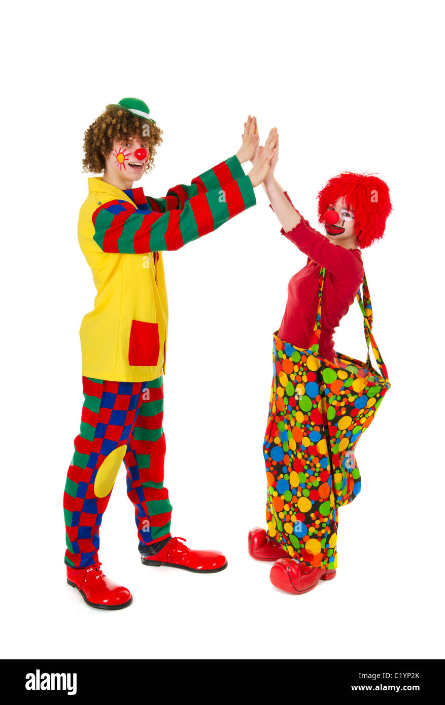 Couple funny full dressed clowns in the studio Stock Photo - Alamy