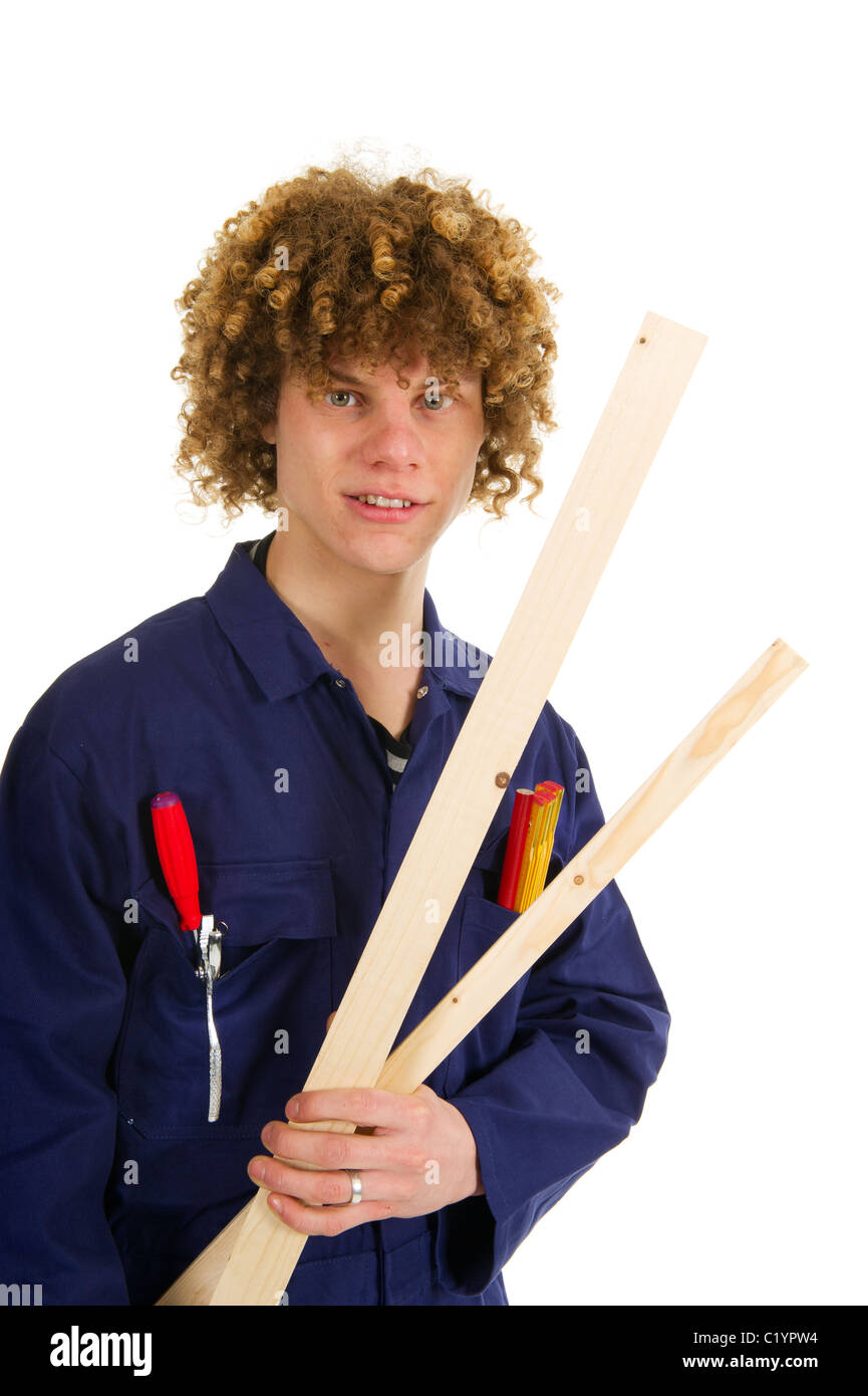 Young boy working as carpenter with timbers and tools Stock Photo - Alamy