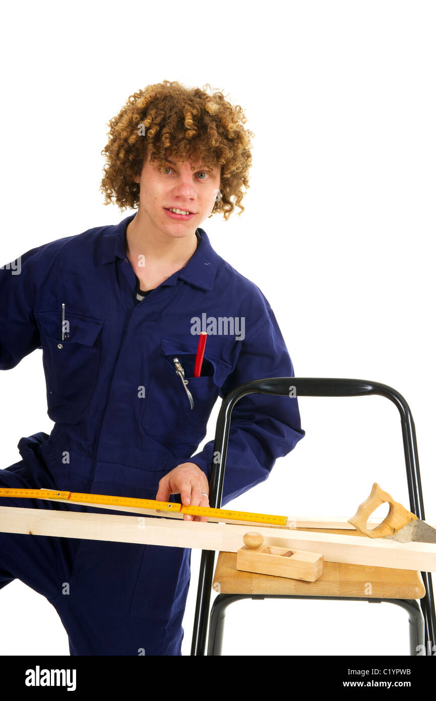 Young boy working as carpenter with timbers and tools Stock Photo - Alamy