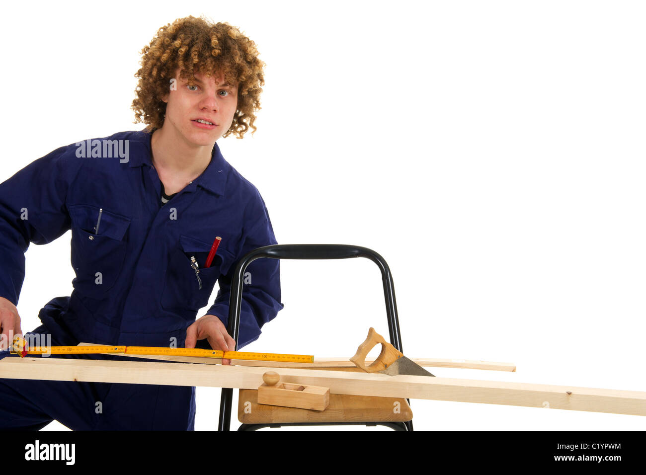 Young boy working as carpenter with timbers and tools Stock Photo - Alamy