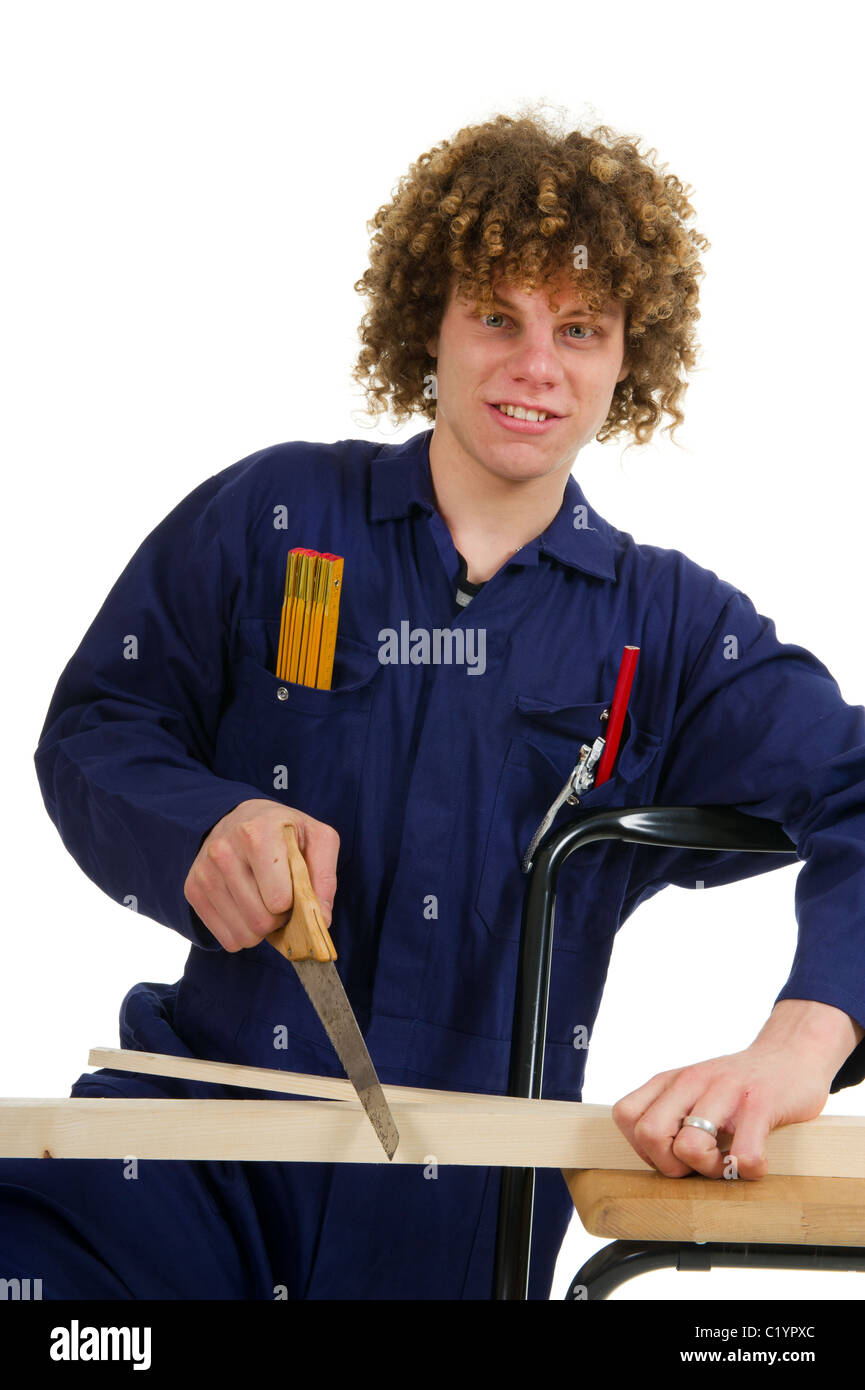 Young boy working as carpenter with timbers and tools Stock Photo - Alamy