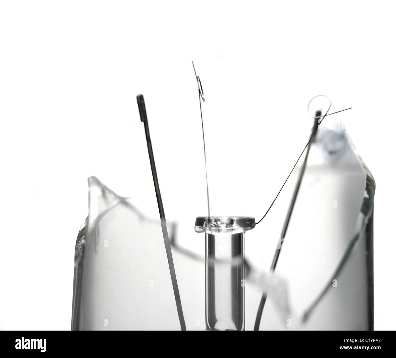 Broken lightbulb detail isolated on white background Stock Photo - Alamy