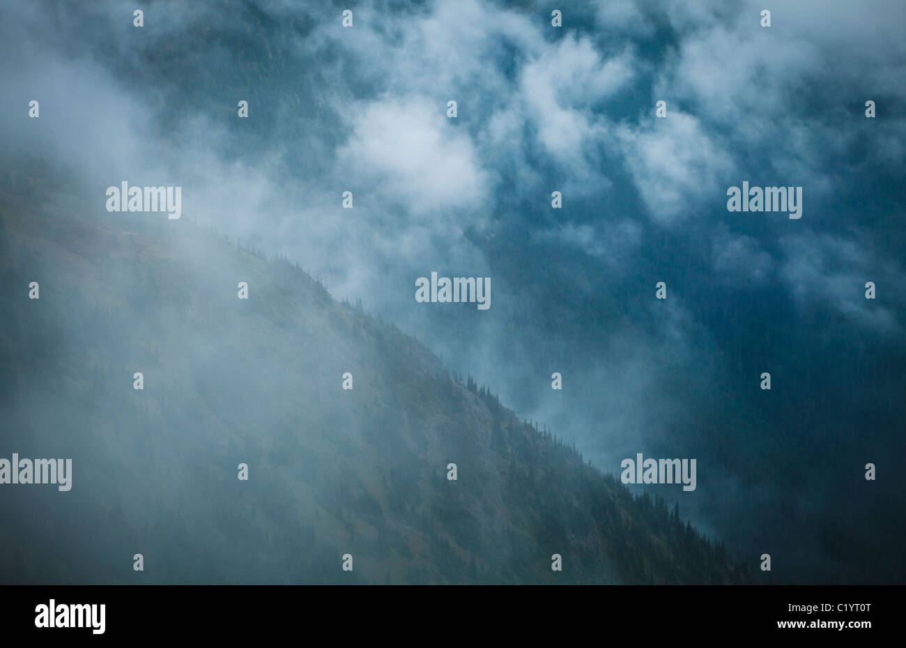 View of a mountain ridge from above looking through clouds. North ...
