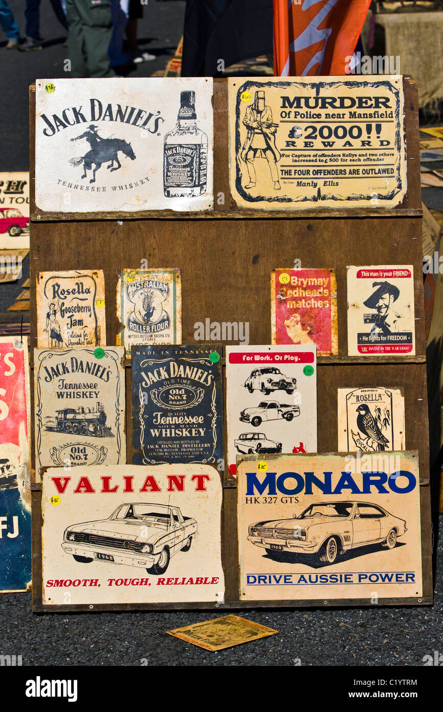 Old posters and signs for sale at a market Stock Photo - Alamy