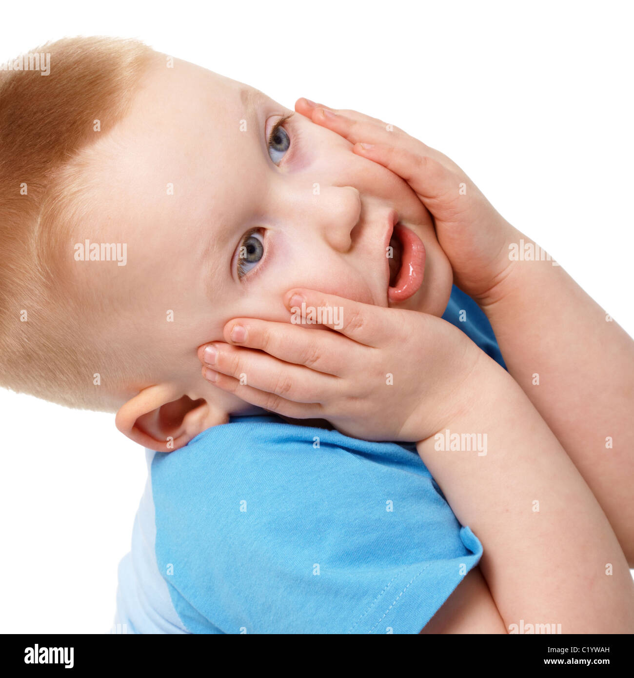 The little boy emotionally grabbed hold of the face isolated on white ...