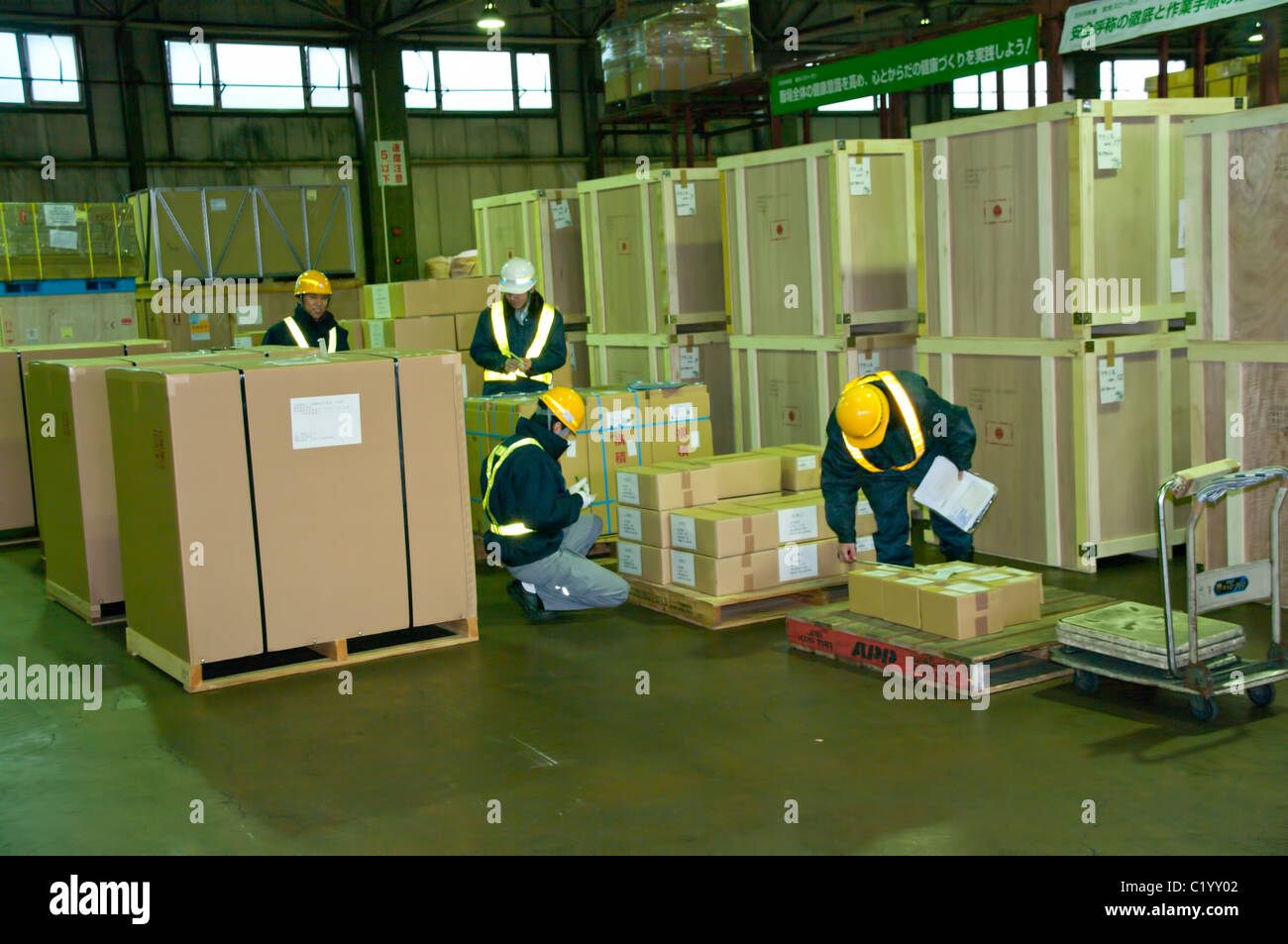 Workers mark cargo departures in the Japanese company nippon express ...