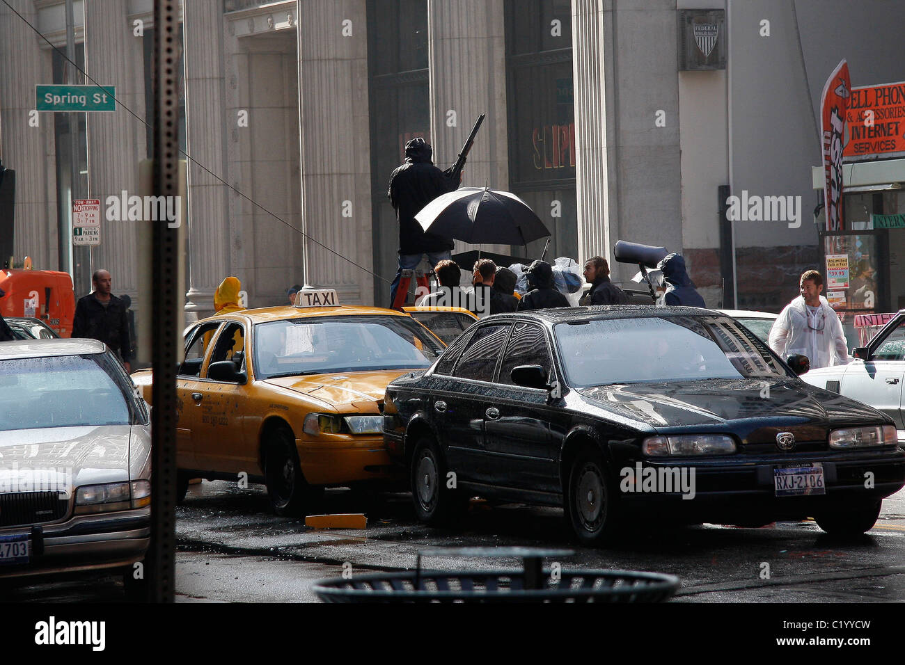 Artificial rain is created for a scene on the film set of the new ...