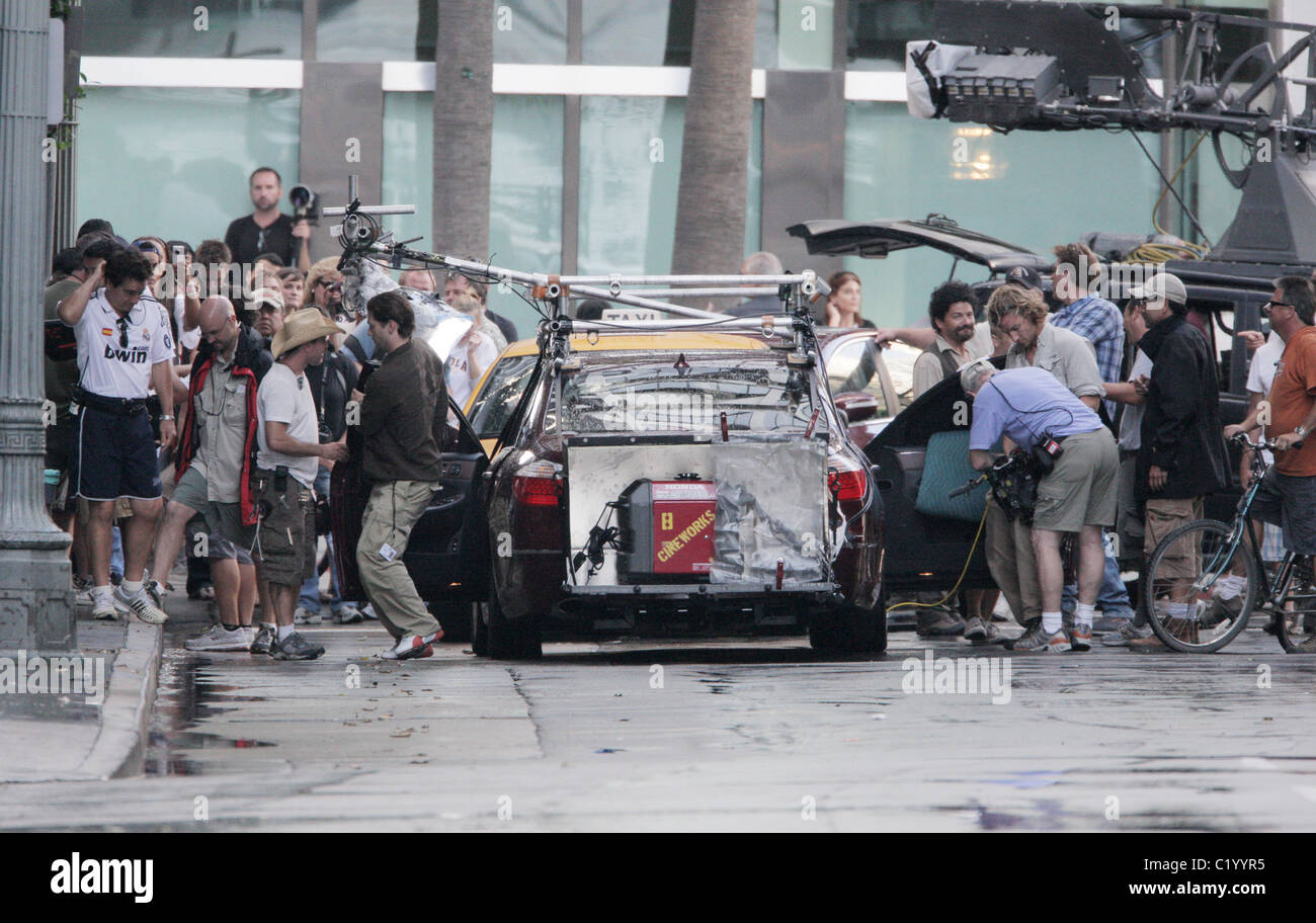 Leonardo DiCaprio driving a car in the rain while filming a scene for ...