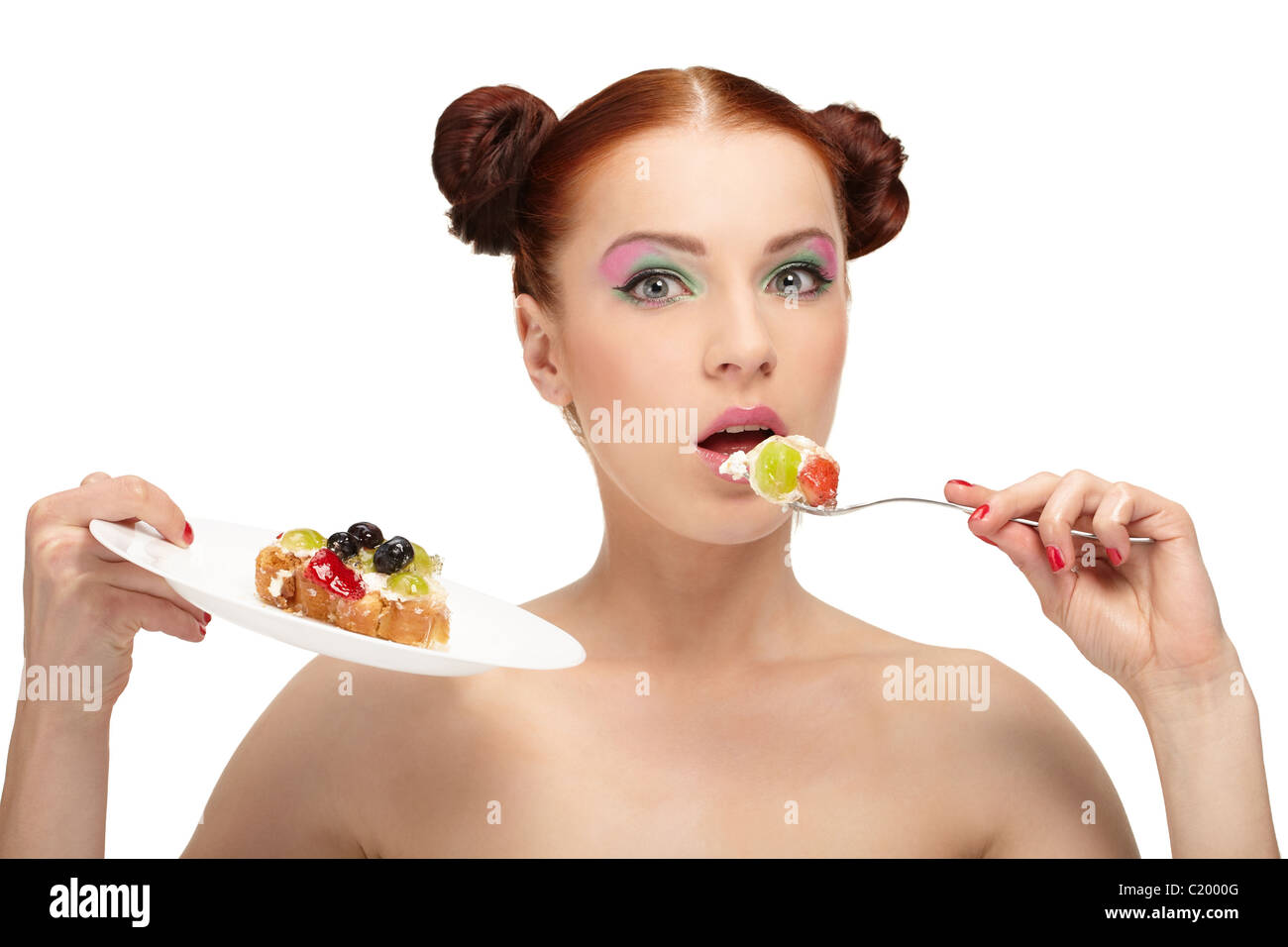 The beautiful young woman eat tasty cake Stock Photo - Alamy