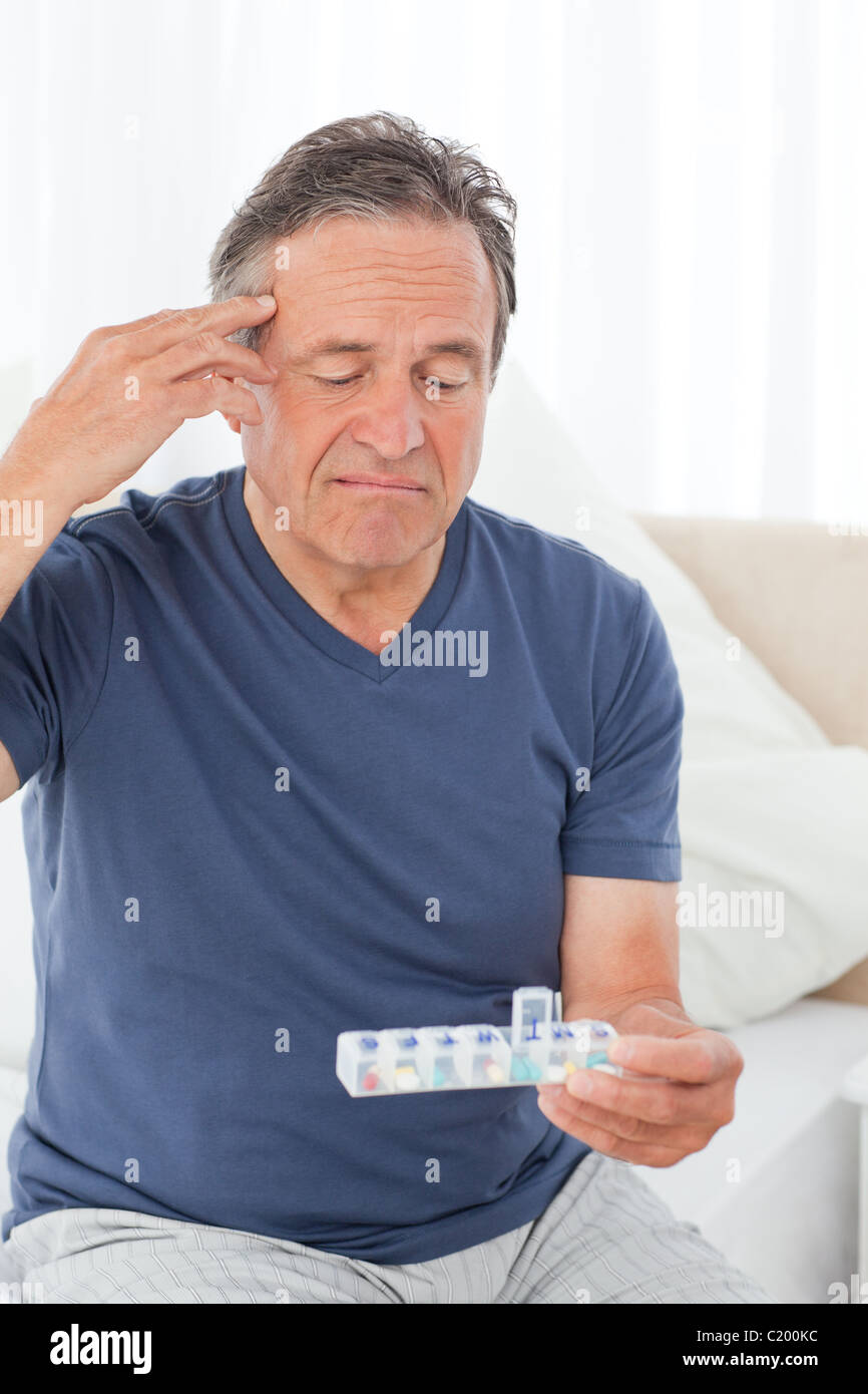 Man 60s taking pill hi-res stock photography and images - Alamy