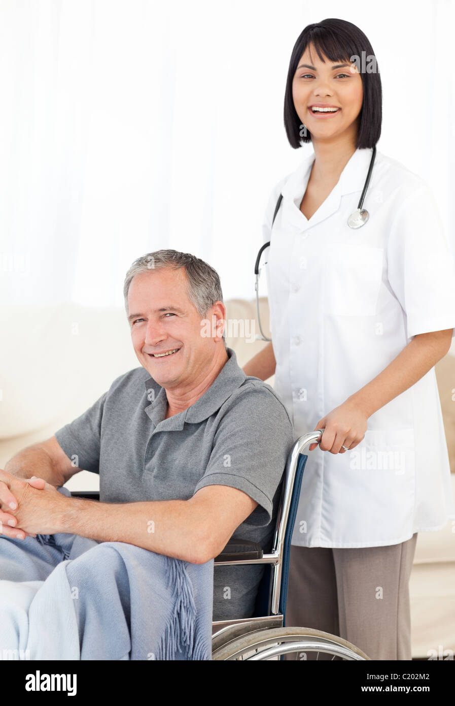 Nurse with her patient looking at the camera Stock Photo - Alamy