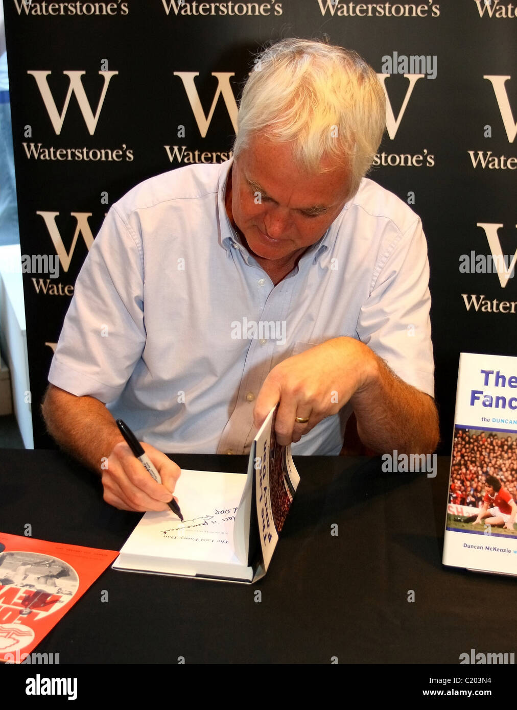 Former Everton footballer, Duncan McKenzie, signs copies of his book ...