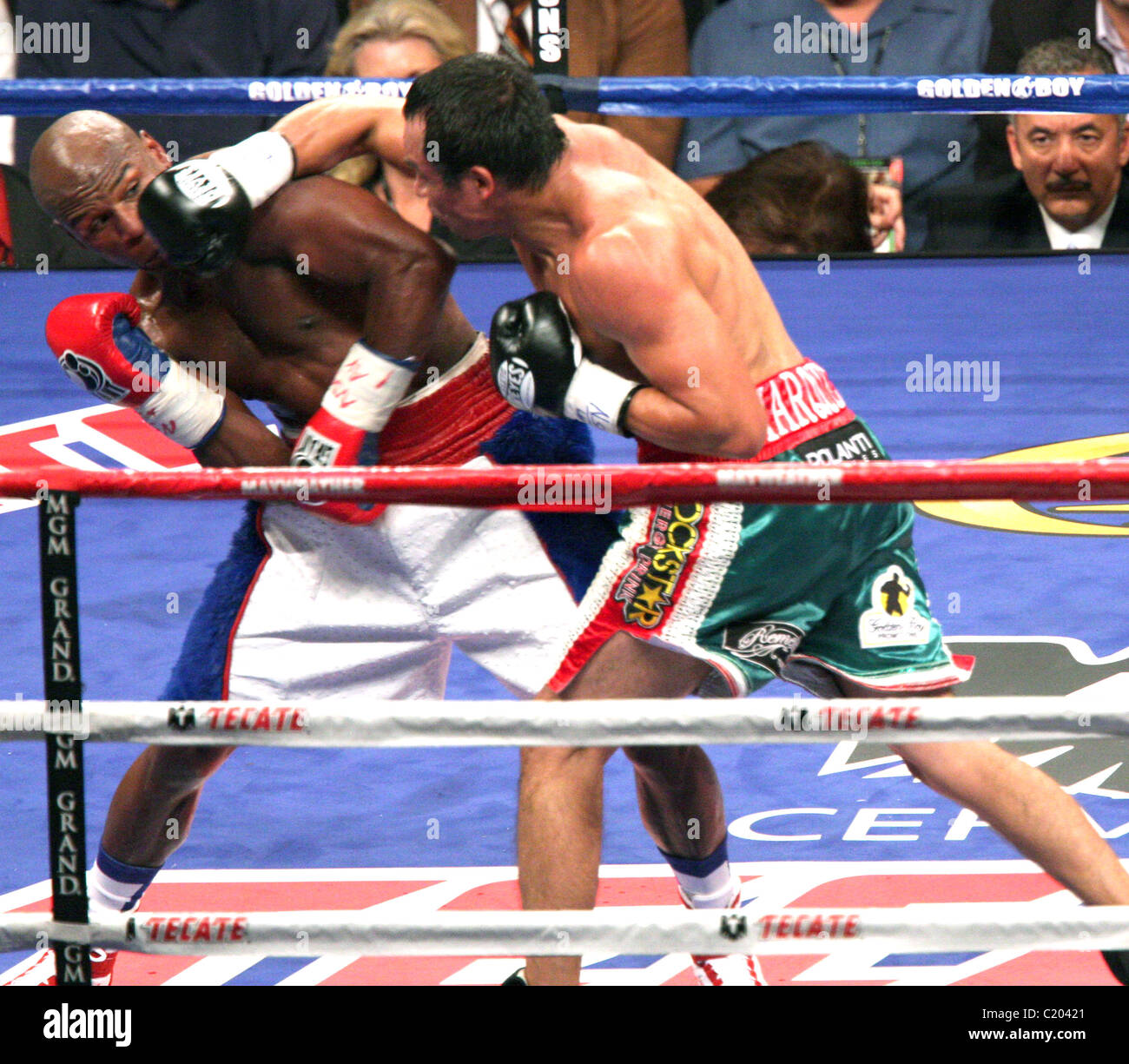 Floyd Mayweather (left) of the US dodges a punch from Juan Manuel ...