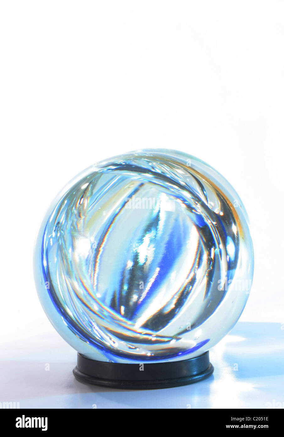 Crystal ball blue light within against white Stock Photo - Alamy