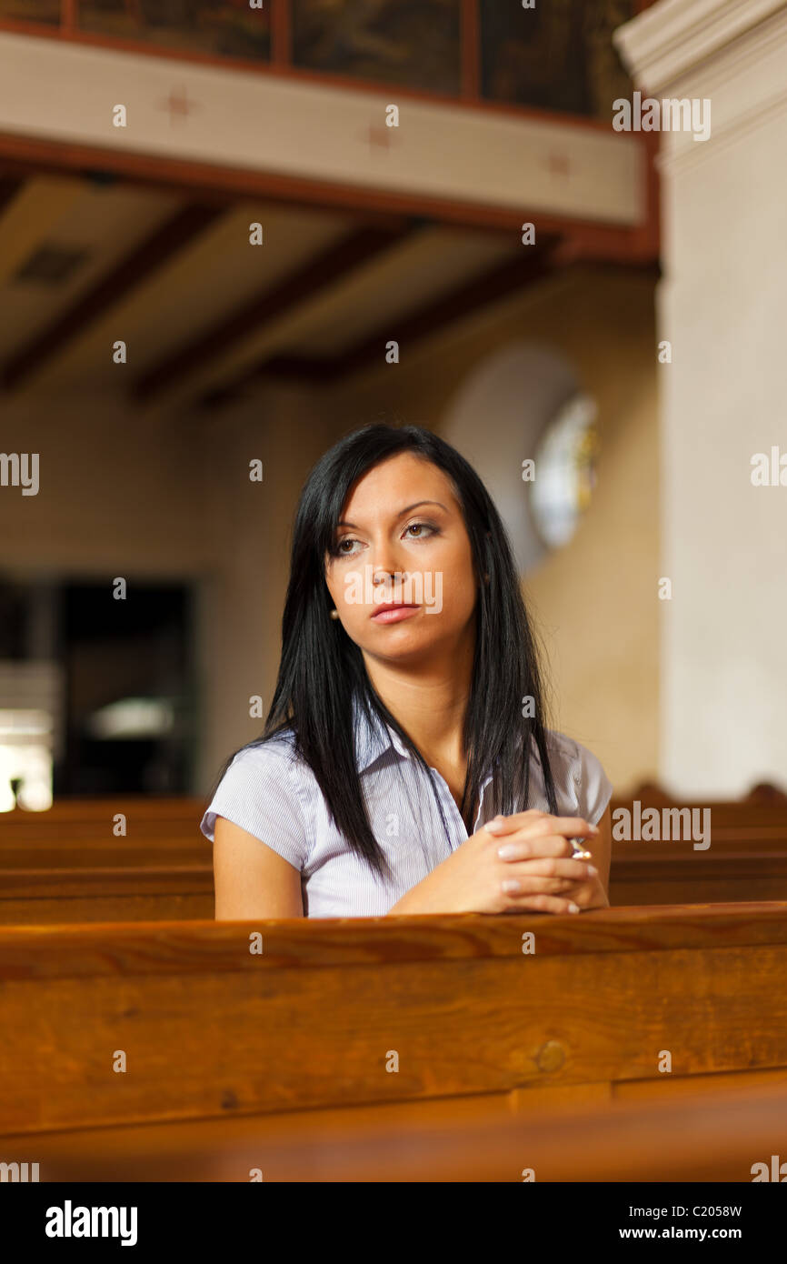 Woman prays in a church Stock Photo - Alamy