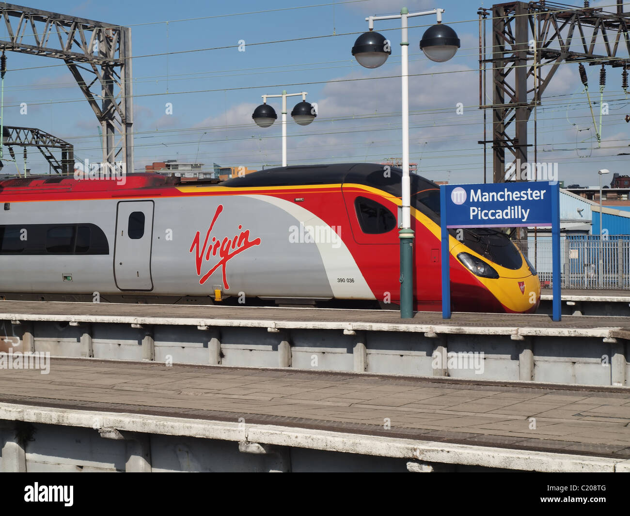 A class 390 'Pendolino' train operated by Virgin Trains leaving ...