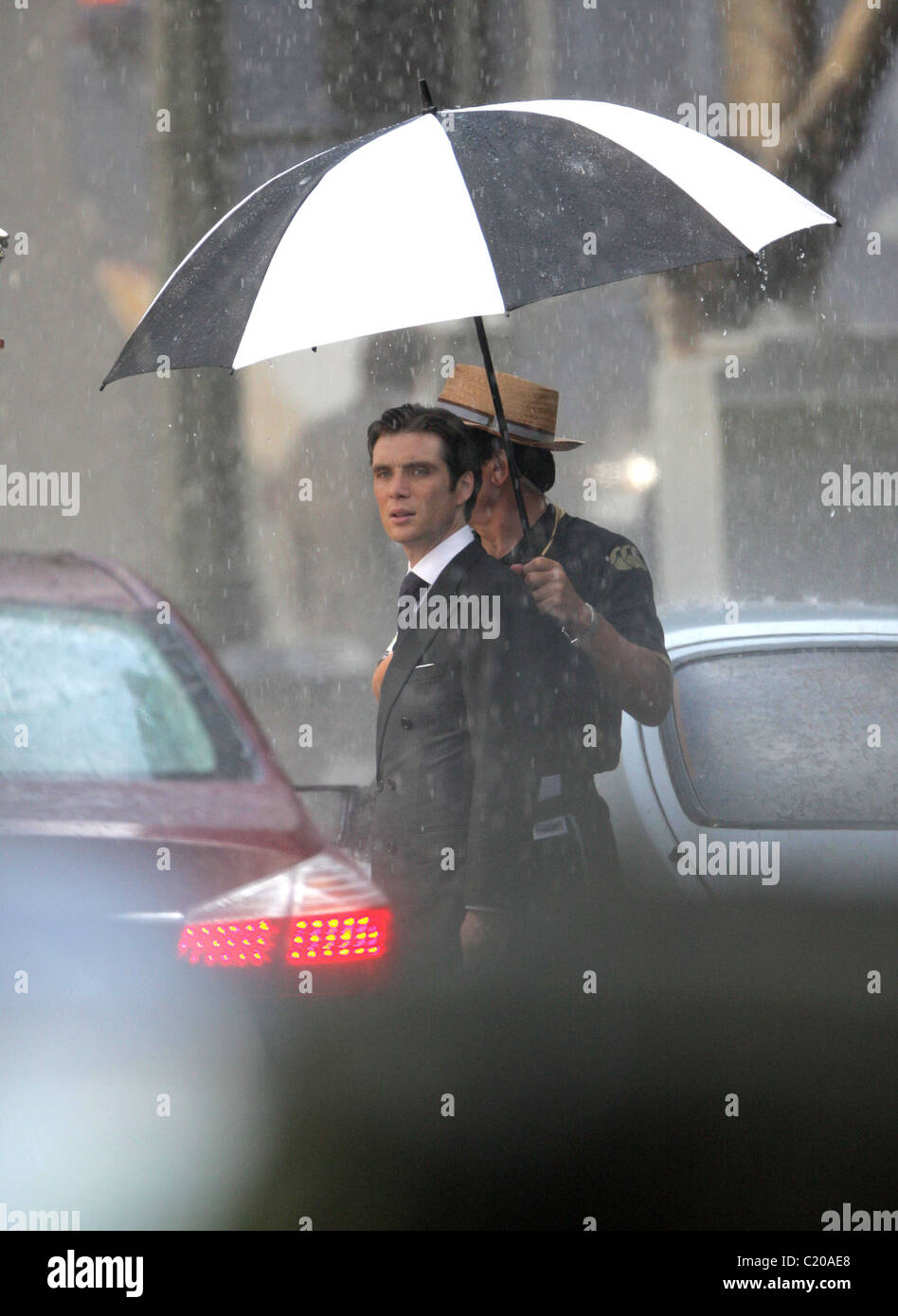 Cillian Murphy shoots a scene in the rain on the set of his new movie ...