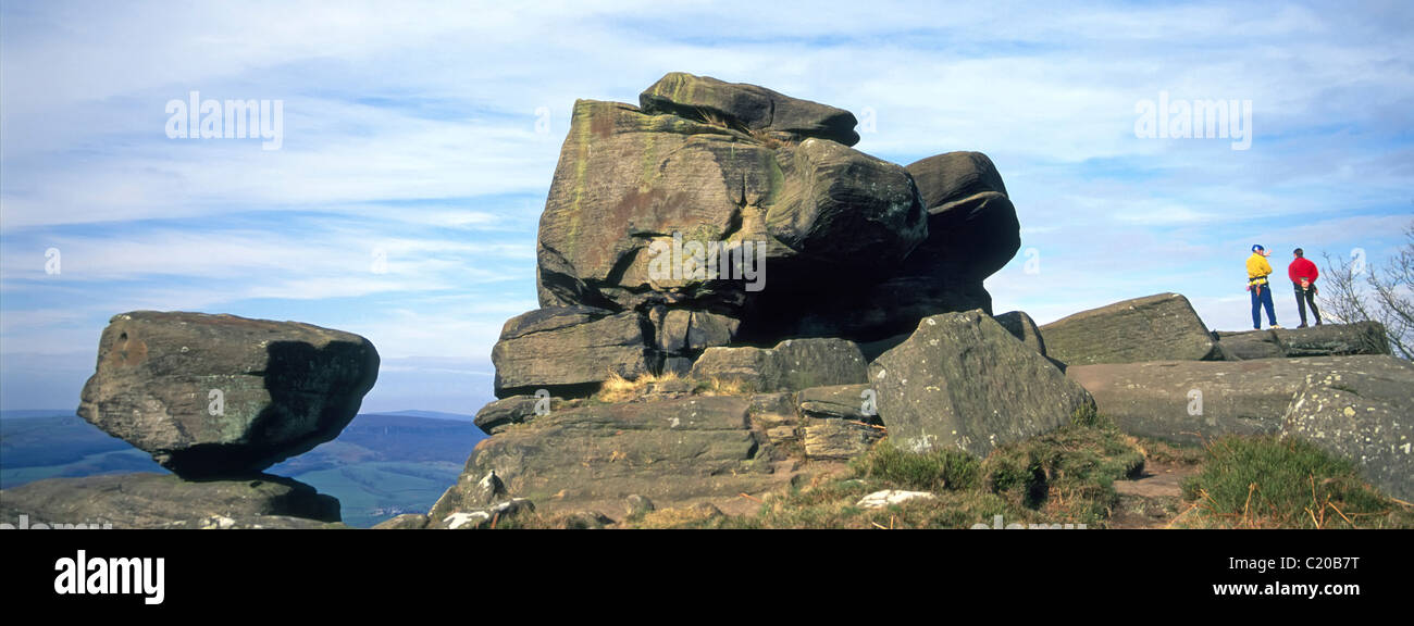 Brimham Rocks landscape of Millstone Grit rock with climbing instructor ...