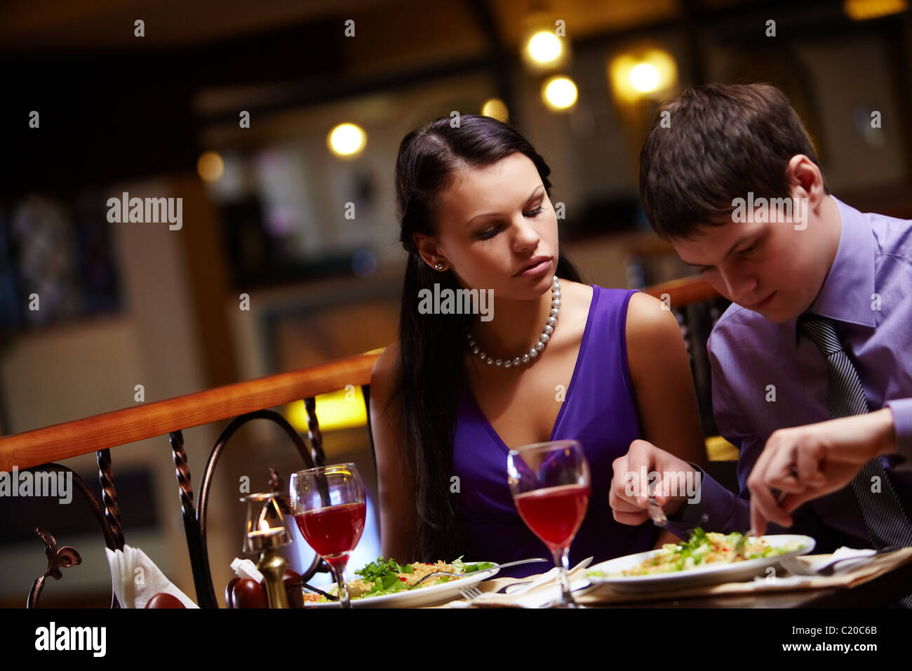 Portrait of hungry woman looking at man’s food in cafe Stock Photo - Alamy