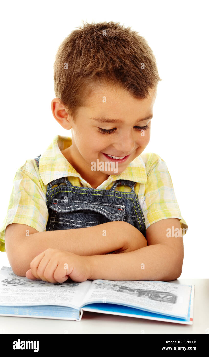 Portrait of a little boy reading a book Stock Photo - Alamy