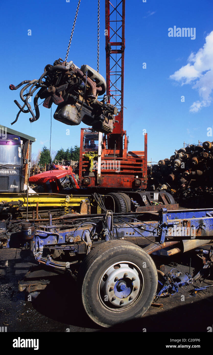 crane lifting lorry engine from lorry chassis for recycling at ...