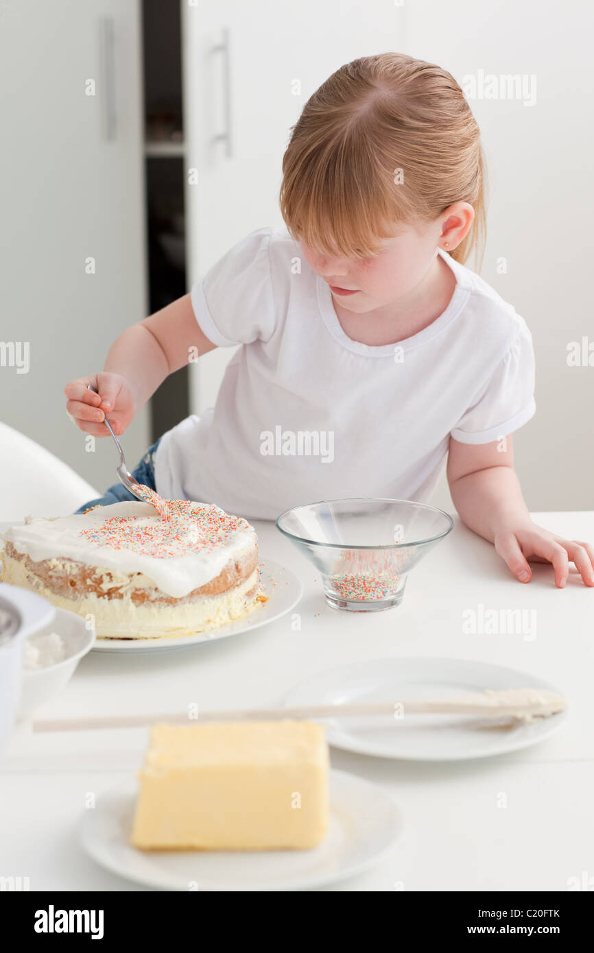 Adorable girl baking in her kitchen Stock Photo - Alamy