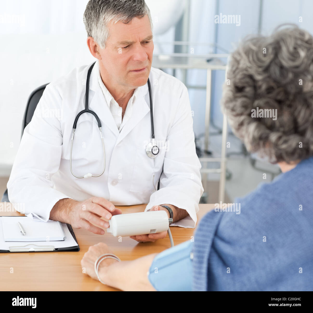 A senior doctor with his patient Stock Photo - Alamy