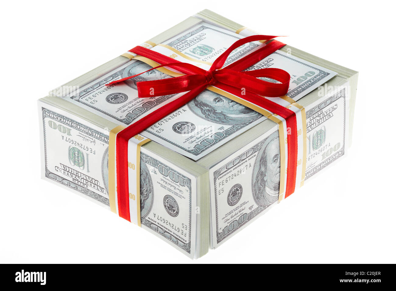 Photo of box made up of dollars decorated with red ribbon over white ...