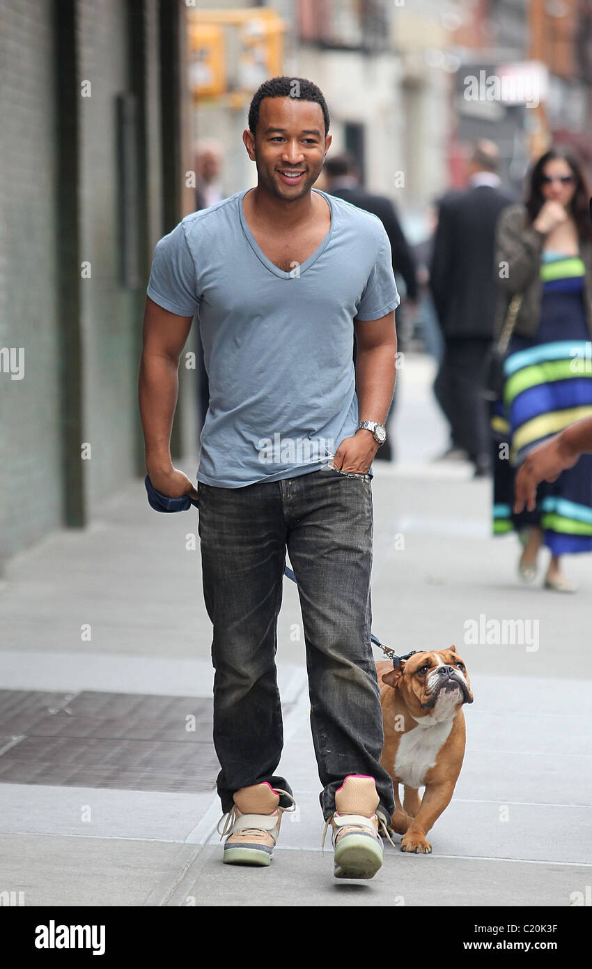 John Legend walks his bulldog in Soho. New York, USA - 23.09.09 Stock ...