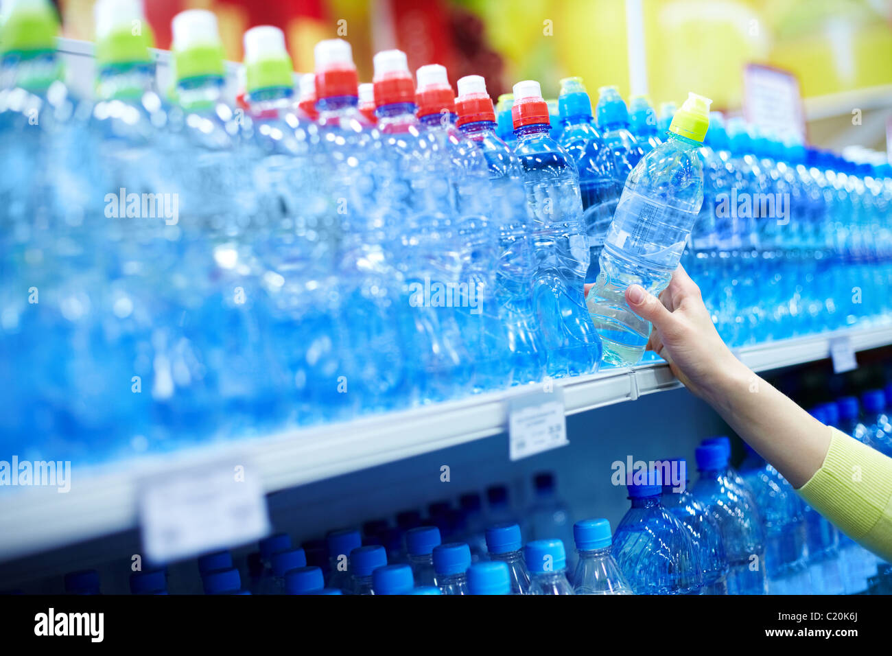 Close-up of female choosing good mineral water in a shop Stock Photo ...
