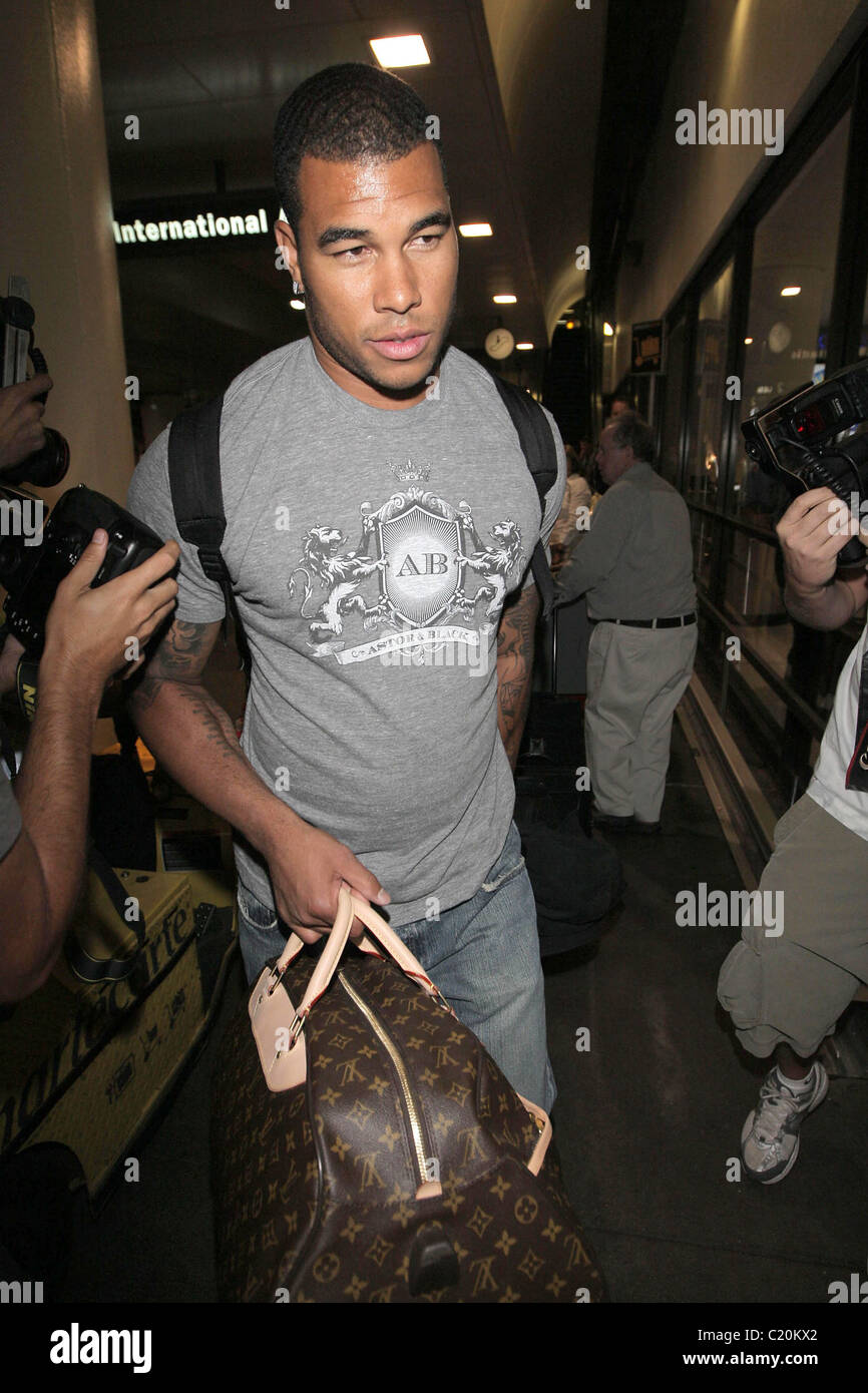 Girls Aloud singer Nadine Coyle and her boyfriend Jason Bell arrive at ...