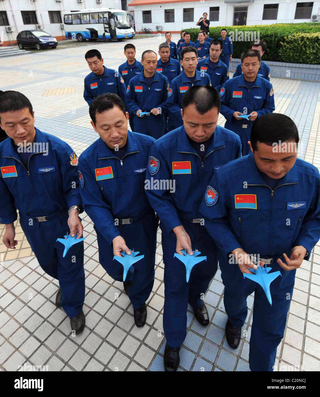 Chinese Air Force fighter pilots use model plans to choreograph an ...