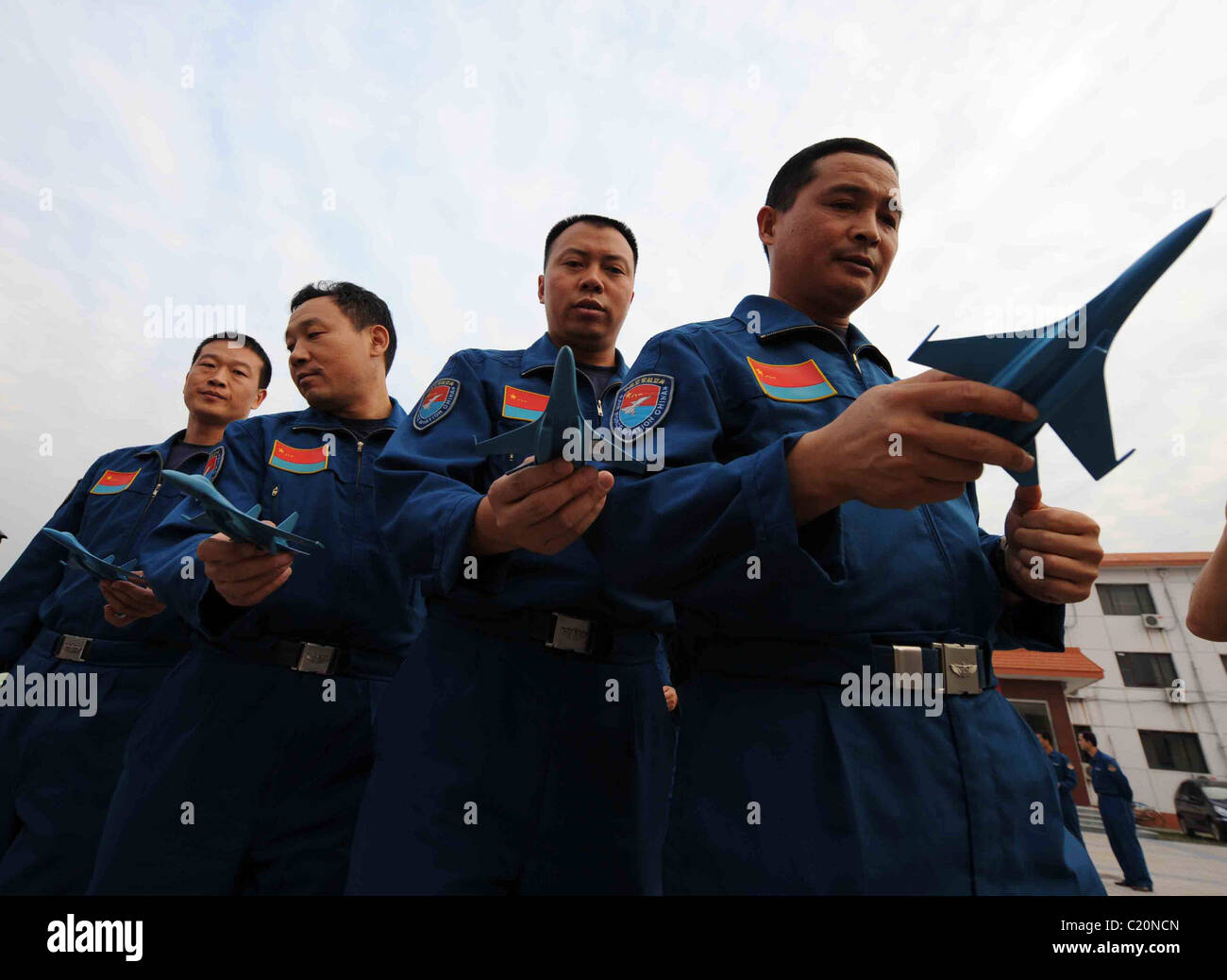 Chinese Air Force fighter pilots use model plans to choreograph an ...
