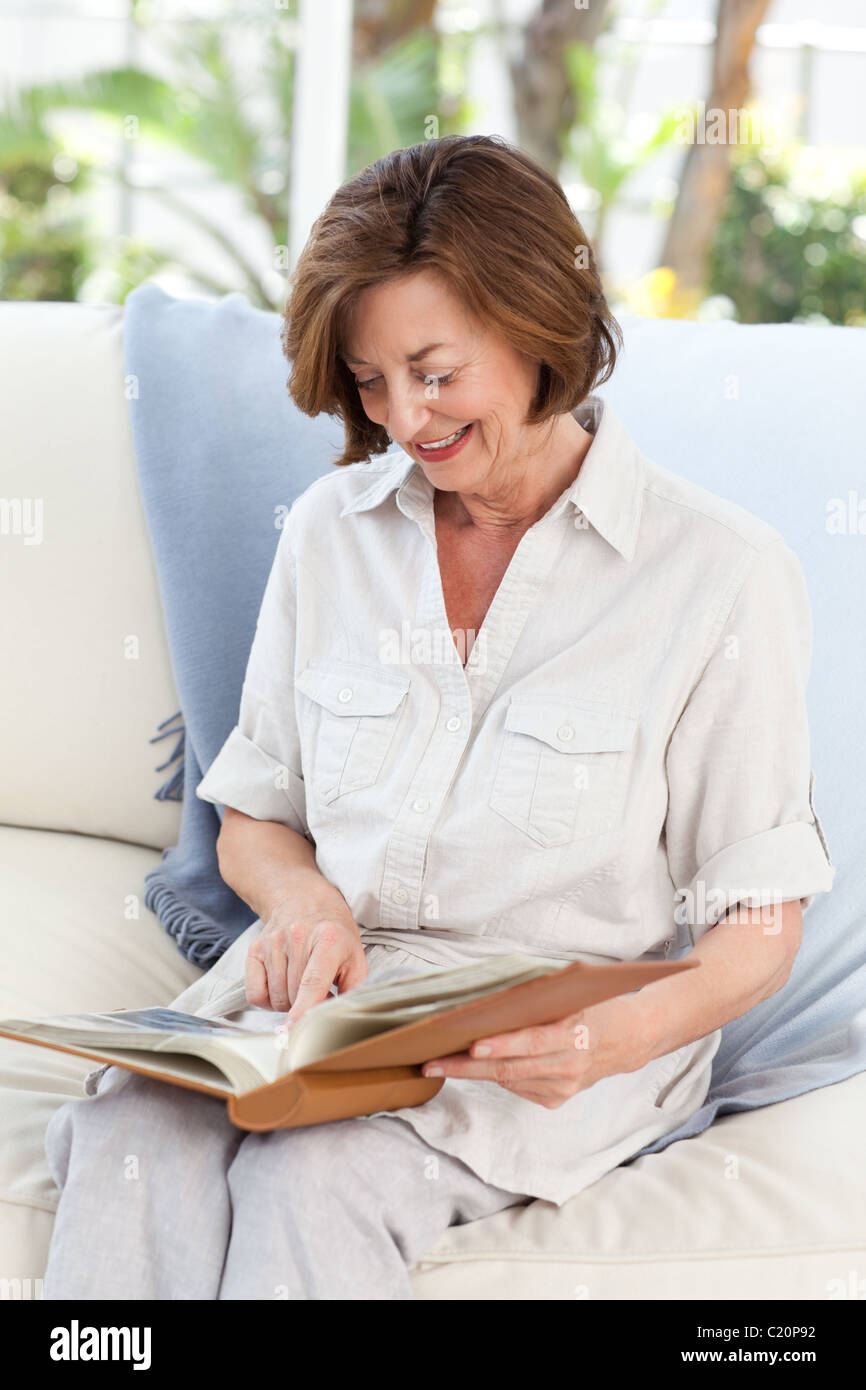 Retired woman reading her book Stock Photo - Alamy