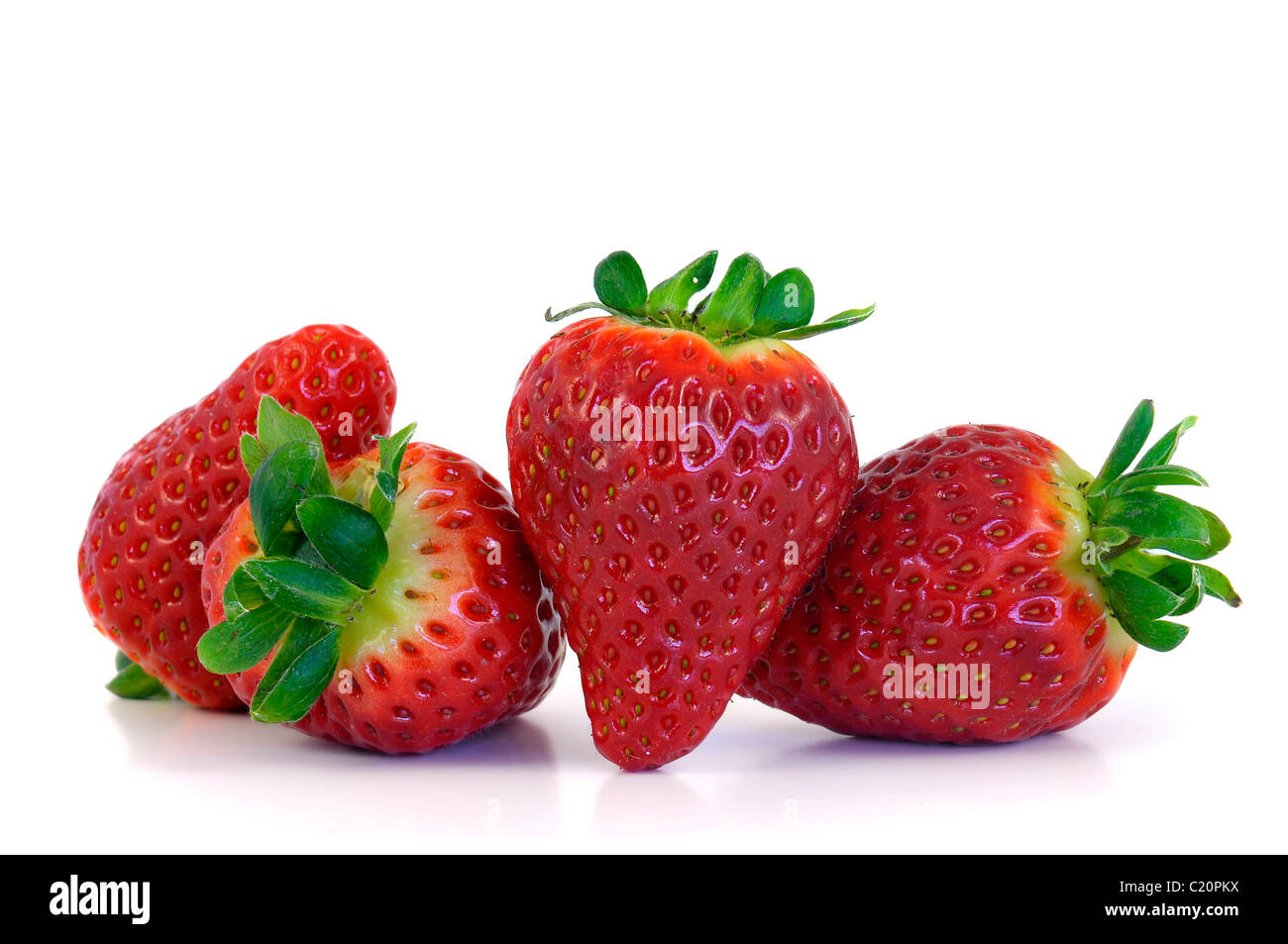 Group of strawberries isolated in white Stock Photo - Alamy