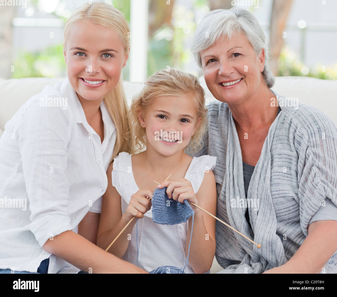 Beautiful family looking at the camera Stock Photo - Alamy
