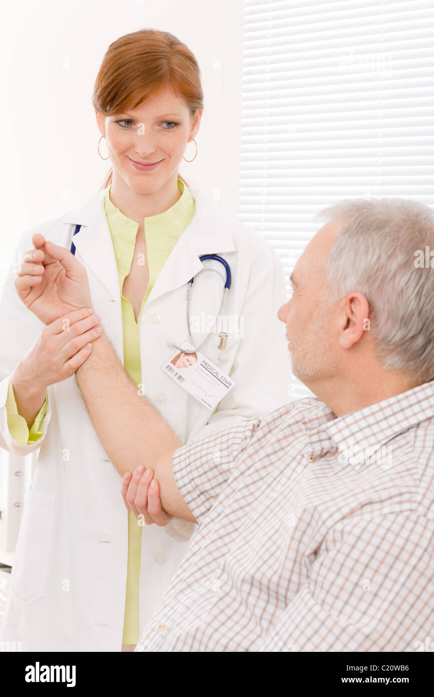 Doctor office - portrait female physician examine senior patient Stock ...