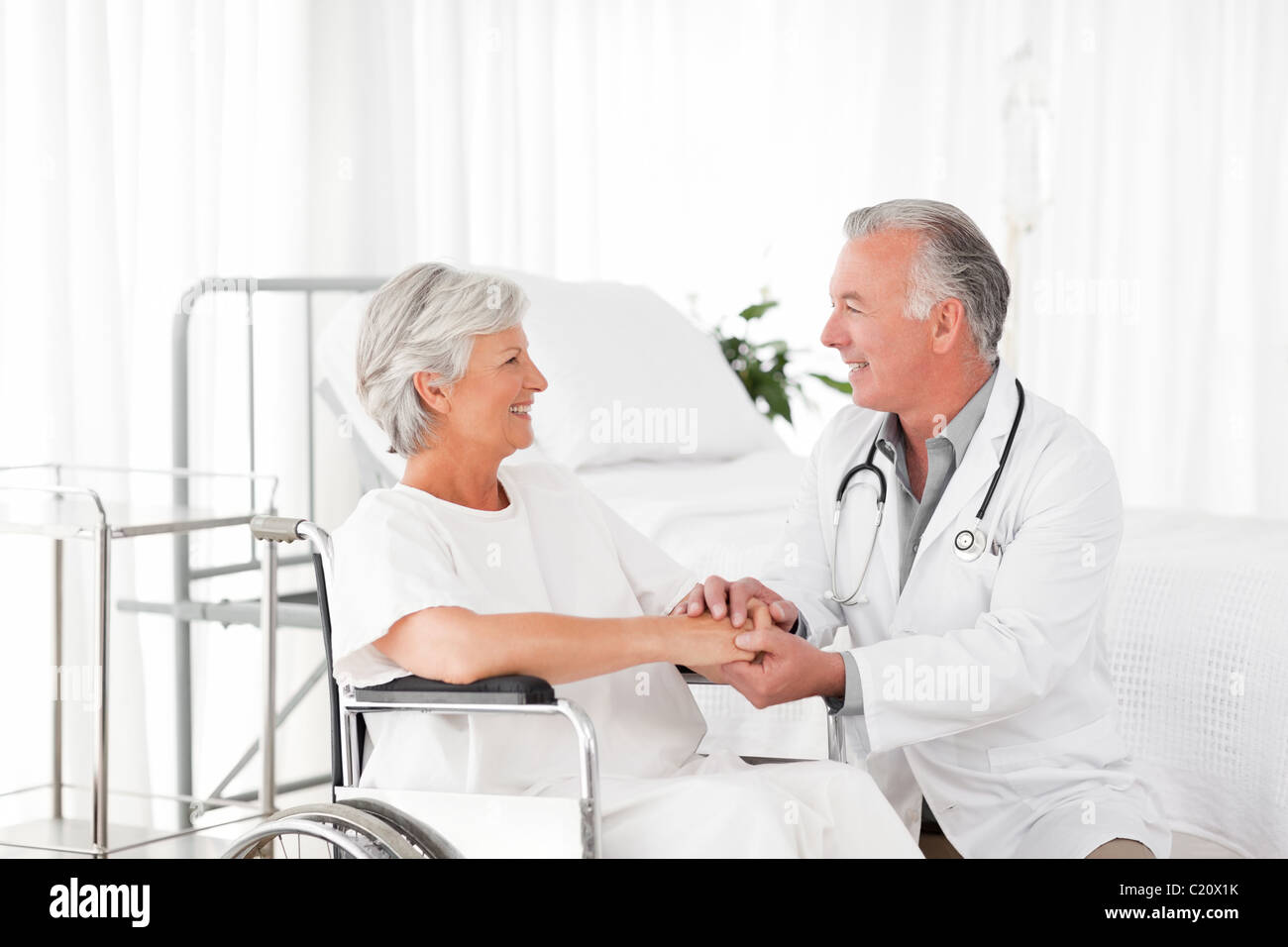 Doctor speaking with his patient Stock Photo - Alamy